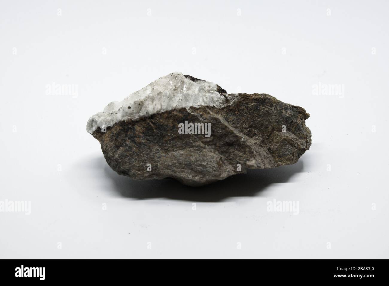 Striped flint stone isolated on a white background. Amazing curves and ...