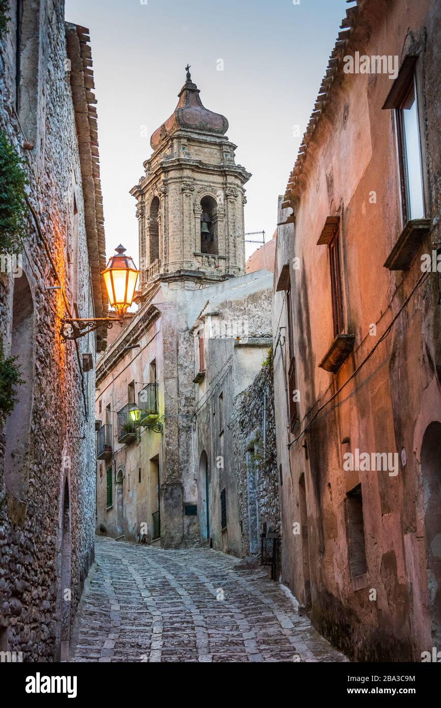 Ancient street and the bell tower of St Julian's Church in the old town ...