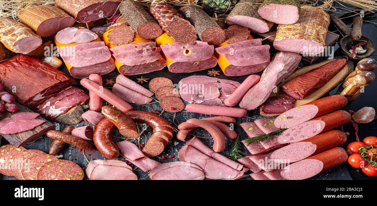 Smoked meat products. Display meats, cold cuts and sausages in a ...