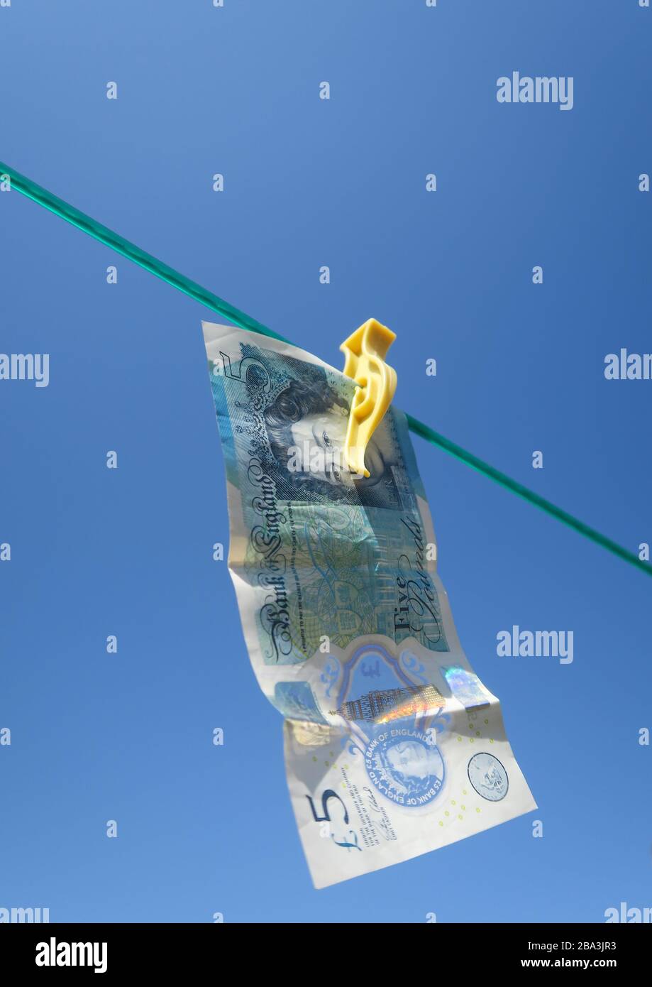 Money hanging out dry hi-res stock photography and images - Alamy