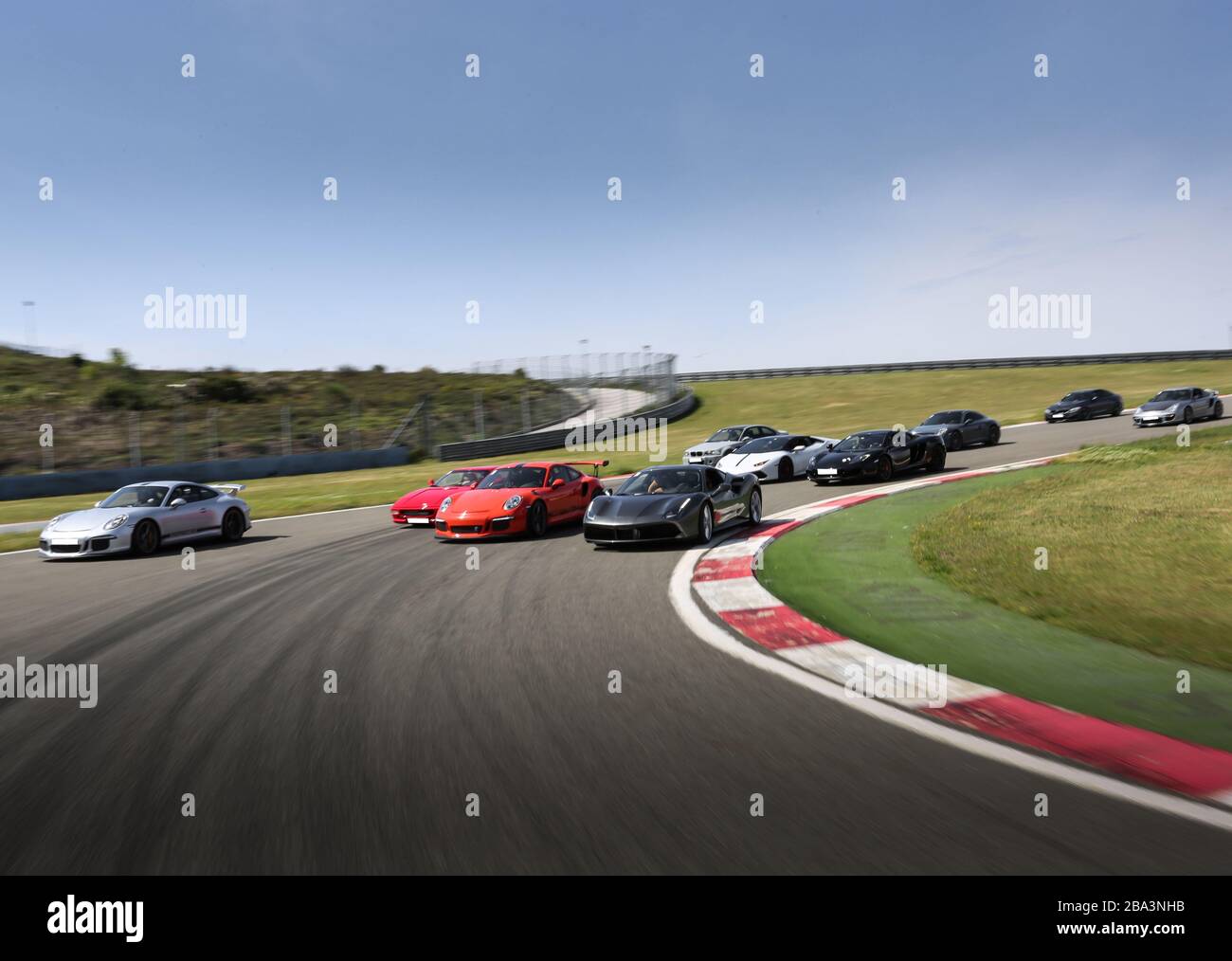 Multiple sport cars racing in the drive trace Stock Photo - Alamy