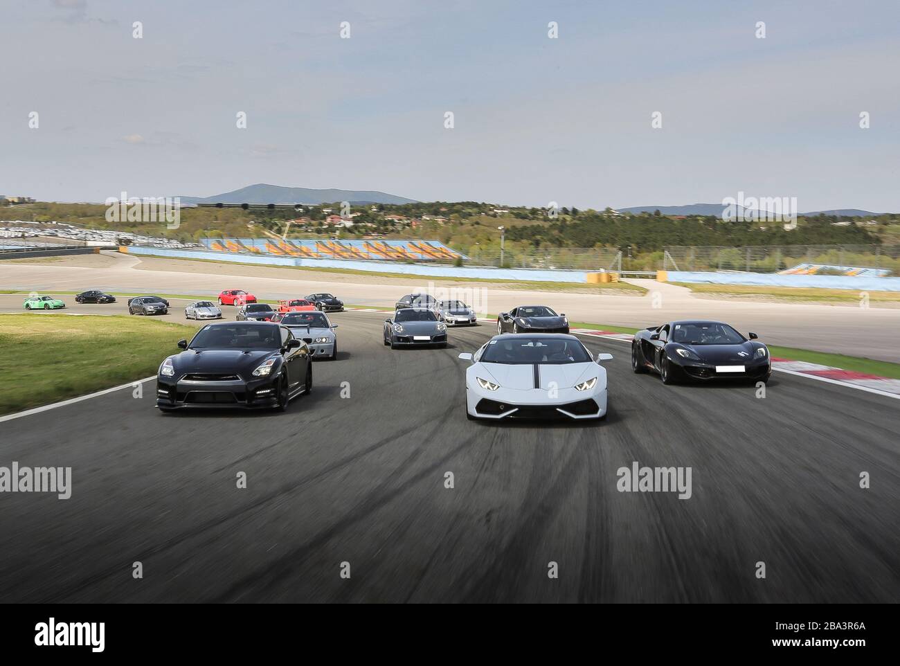 Black and white sport cars race in the trace Stock Photo - Alamy
