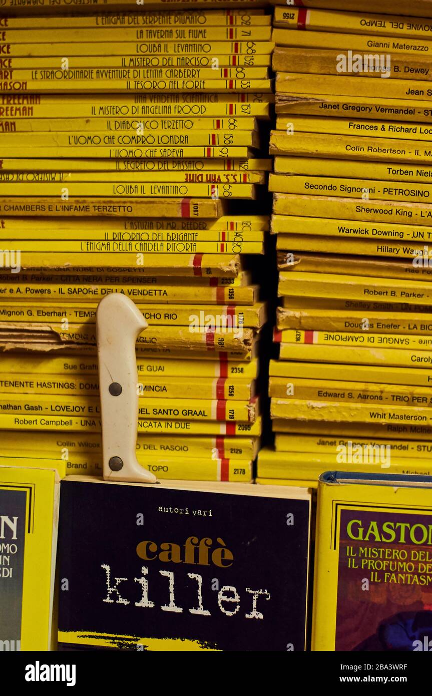 Knife and stack of thriller books Stock Photo - Alamy