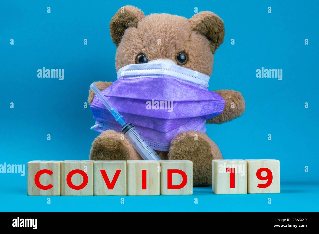 Covid 19. Coronavirus. Big teddy bear are sitting in blue medical masks ...