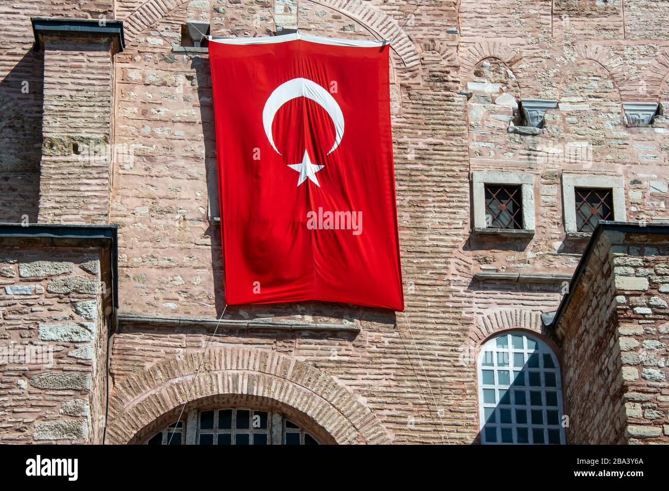 Turkish flag on the brick wall of the Hagia Sophie, Istanbul, Turkey ...