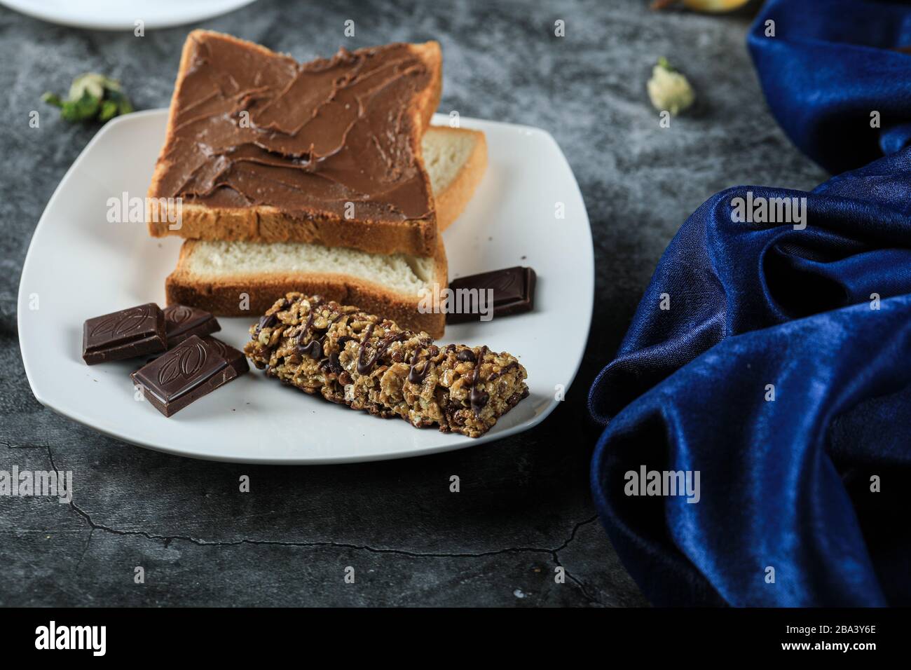 Chocolate bread toast with chocolate pieces in a white saucer Stock ...