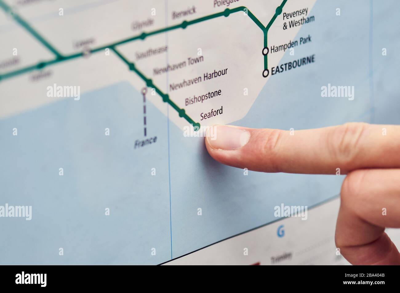Finger pointing on coast map Stock Photo - Alamy