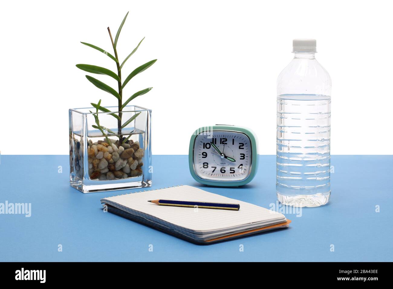 Office Table with Water Bottle and Notepad Stock Photo - Alamy
