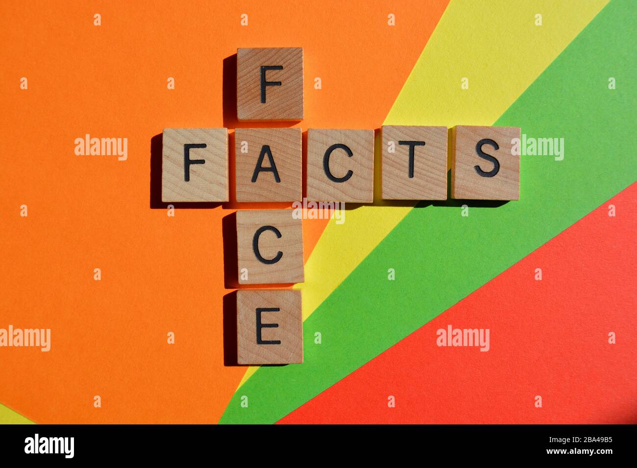 Face Facts, in wooden alphabet letters on a multicoloured background ...