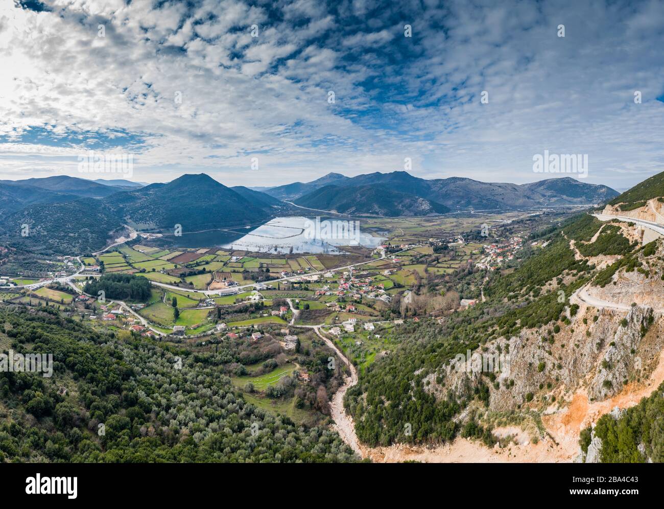 Flight over the flooded valley in Greece. The flooded fields, roads ...