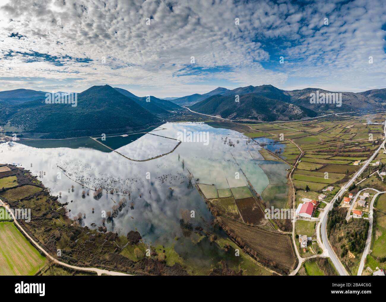 Flight over the flooded valley in Greece. The flooded fields, roads ...