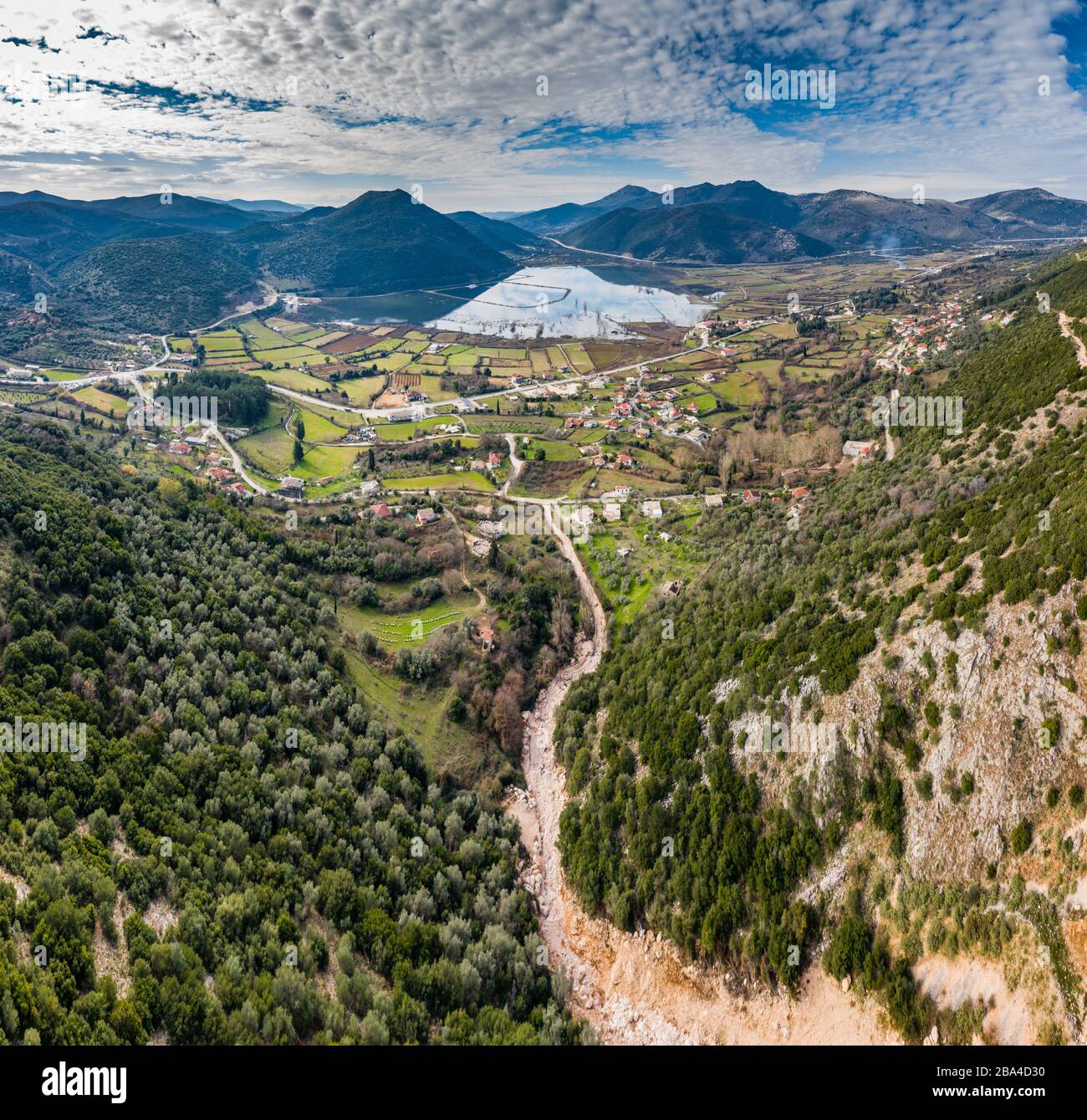 Flight over the flooded valley in Greece. The flooded fields, roads ...
