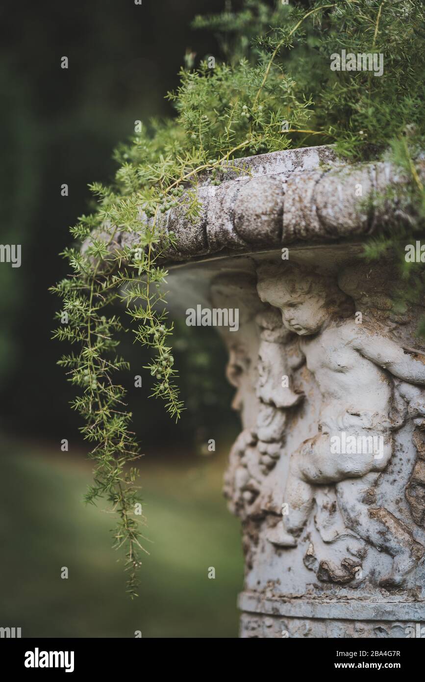 Child chiseled on a decorative 20th Century neoclassical stone planter ...