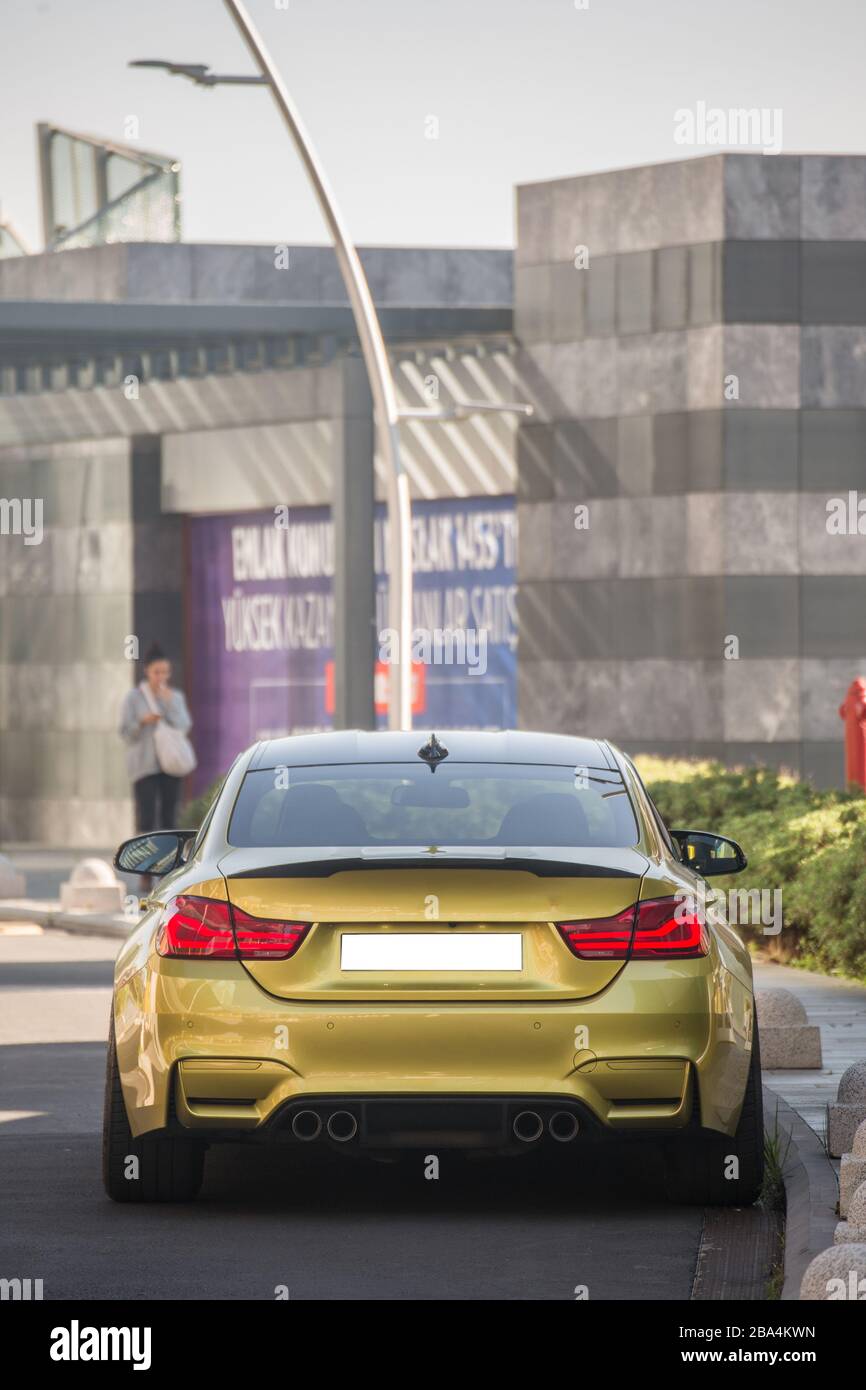 Golden sport sedan car back view Stock Photo - Alamy