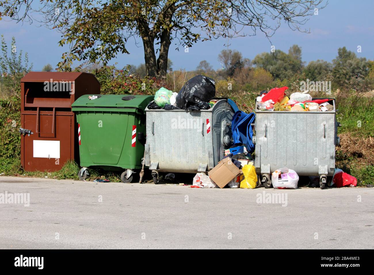 Various large metal and plastic trash containers for ecologically ...