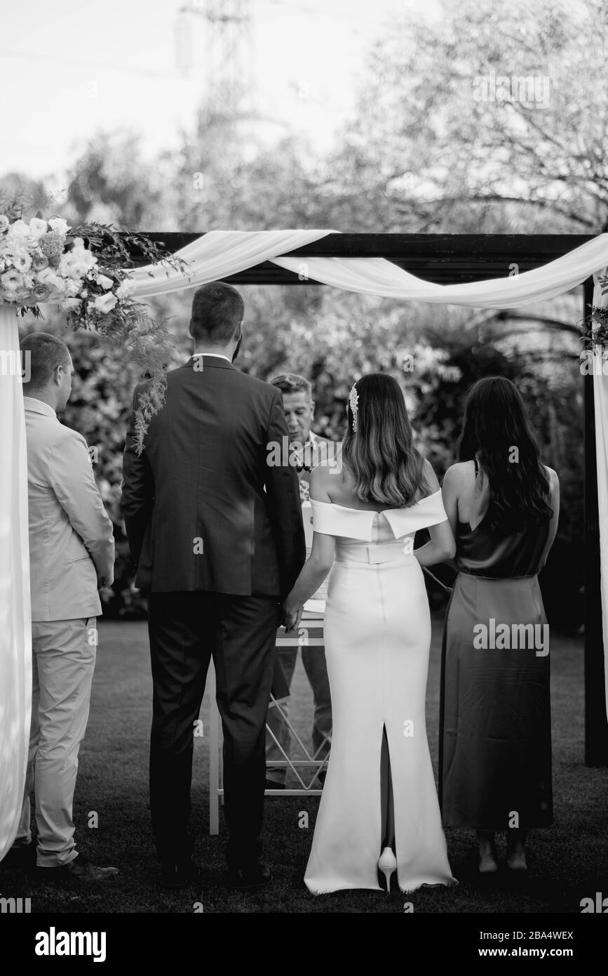 The bride and groom with their witness at the wedding Stock Photo - Alamy