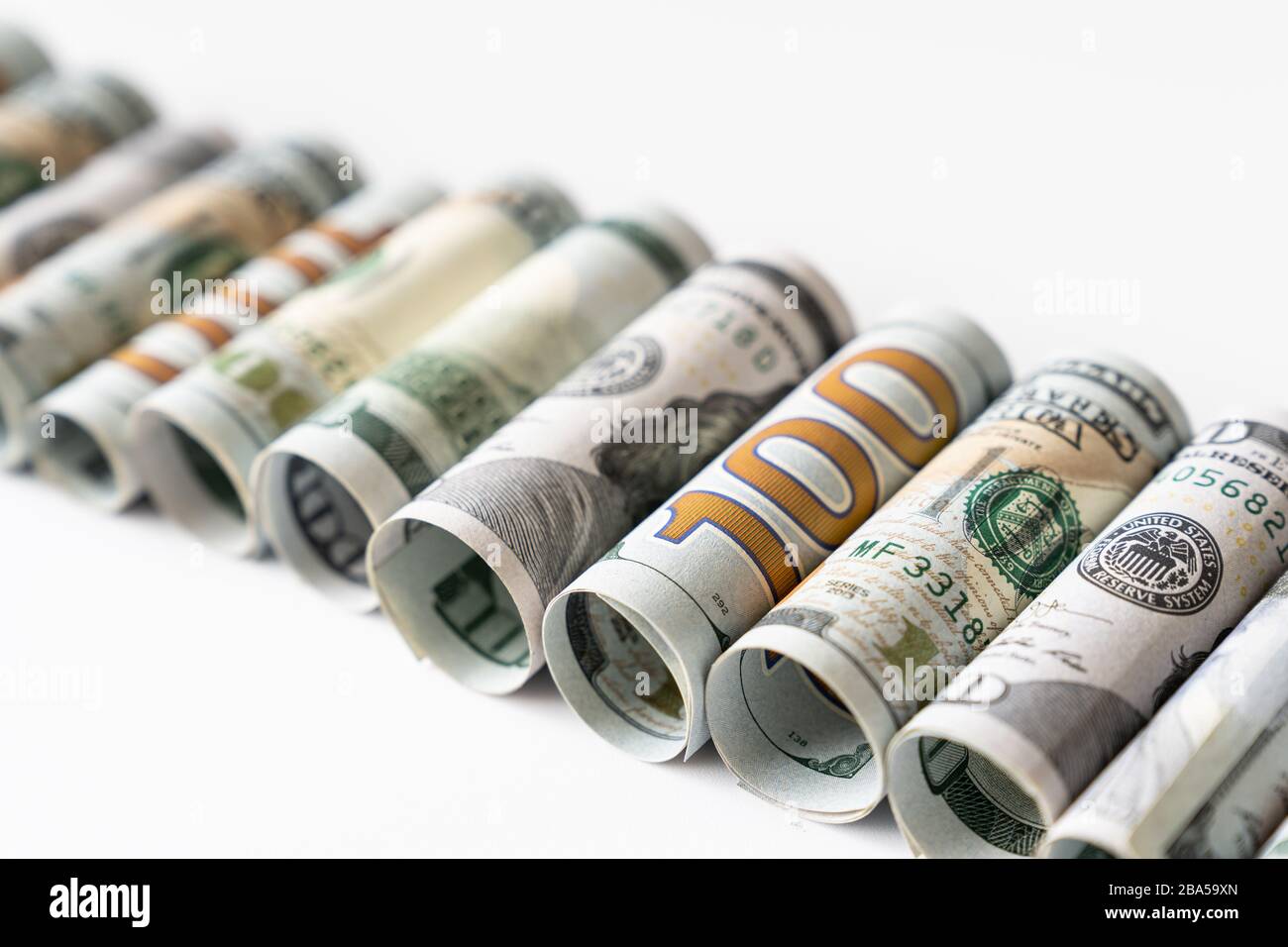 Rolls of US dollar bill in a row Stock Photo - Alamy