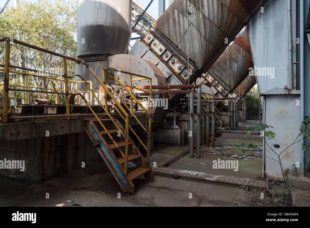 Interior of an old abandoned industrial steel factory Stock Photo - Alamy