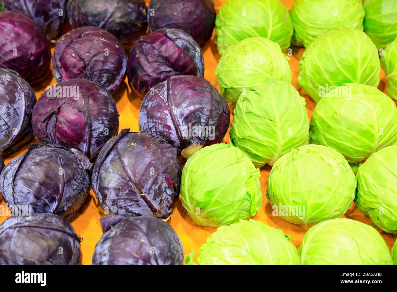Group of red and green cabbages at supermarket. Colorful and healthy ...