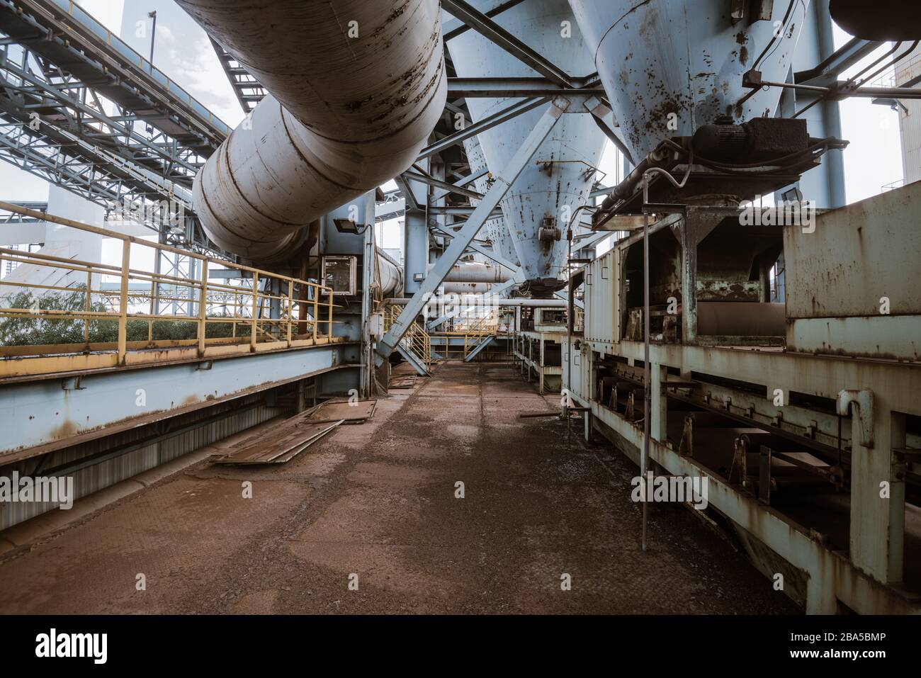 Interior of an old abandoned industrial steel factory Stock Photo - Alamy