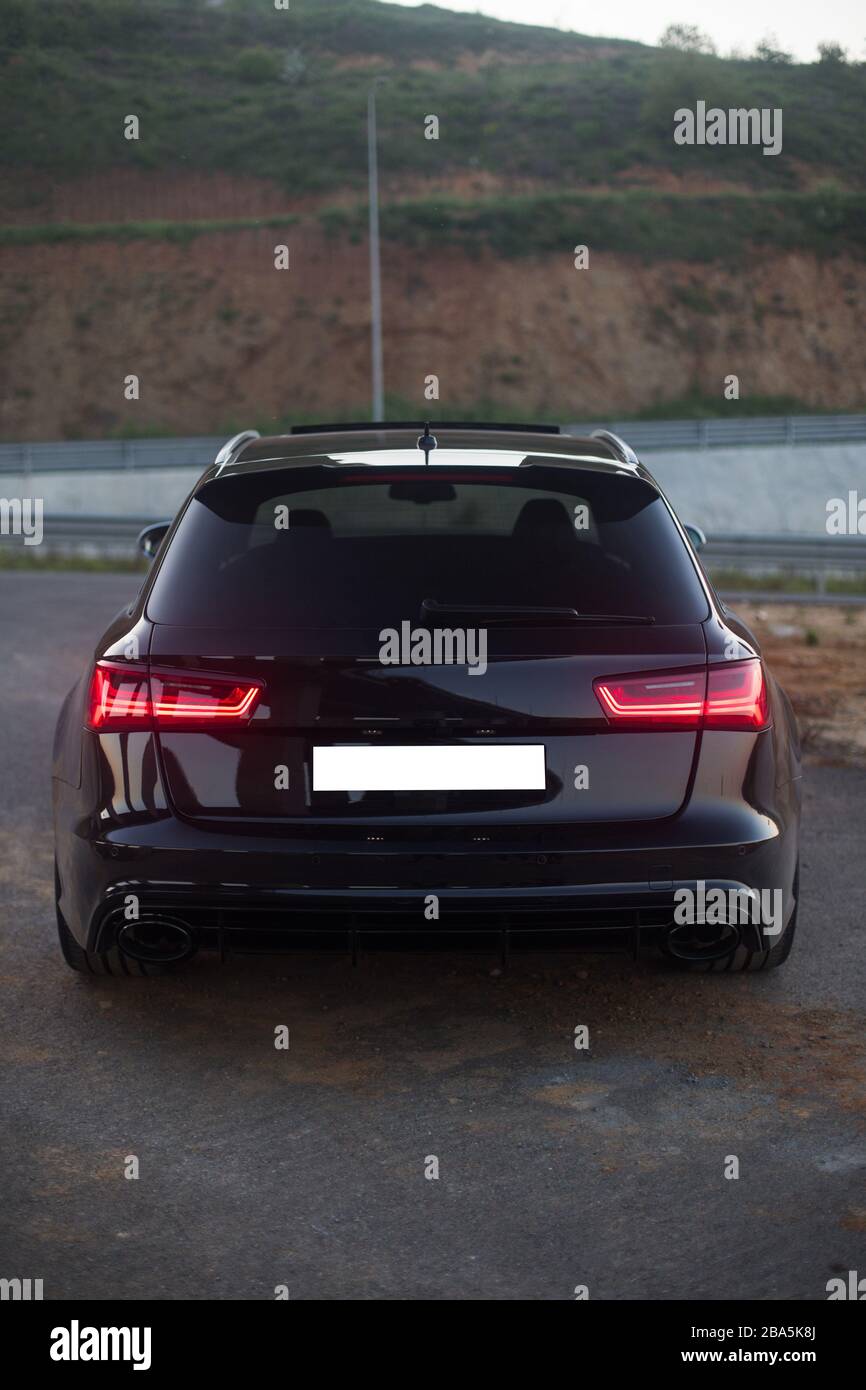 Black hatchback with xenon lights Stock Photo - Alamy
