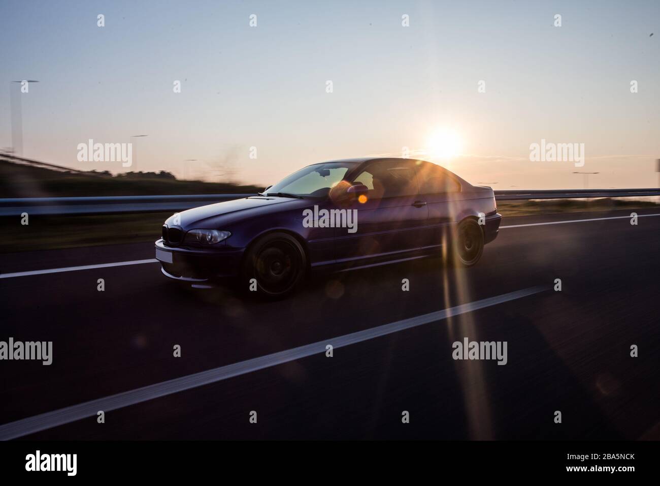 Black business class car in a sunny background Stock Photo - Alamy