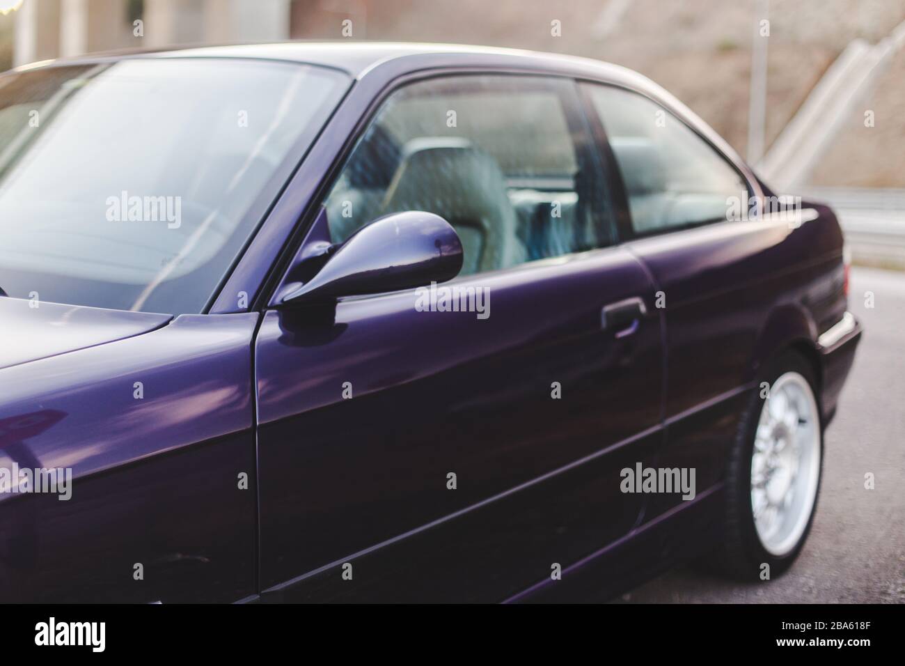 Purple color sedan in the parking zone Stock Photo - Alamy