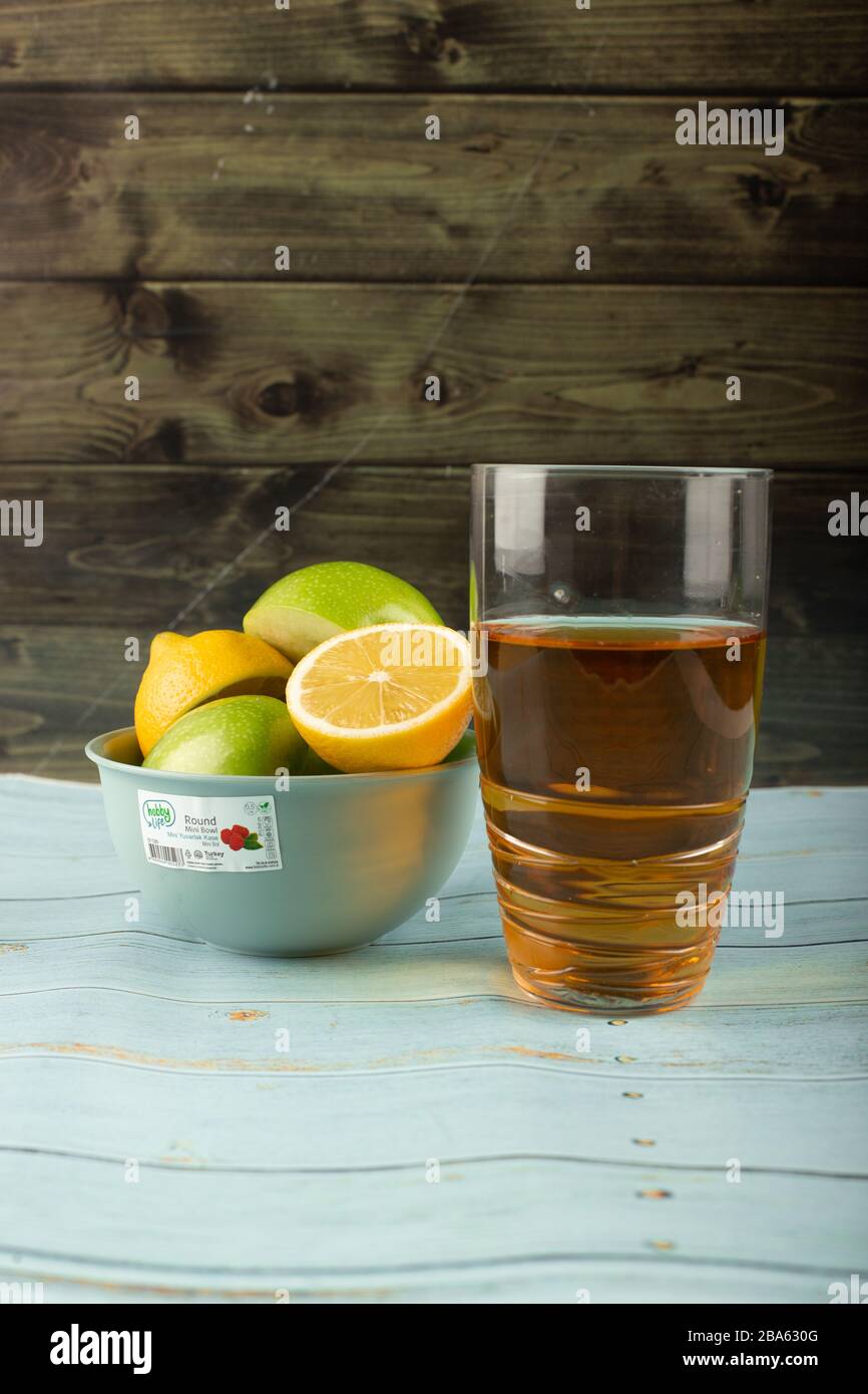 Green apple and lemons, and a glass of apple juice Stock Photo - Alamy