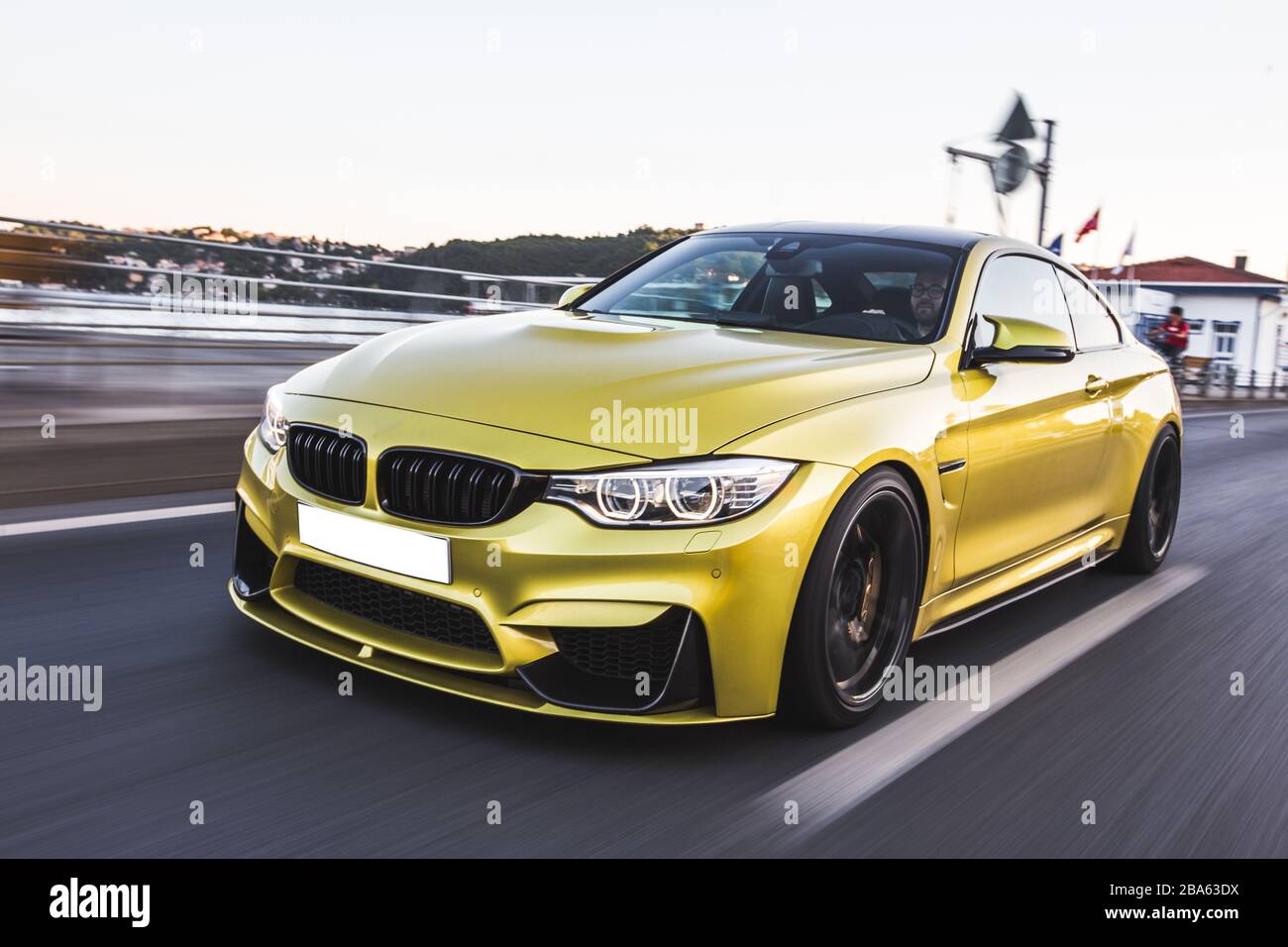 Golden sport sedan car on the autobahn. high speed drive Stock Photo ...