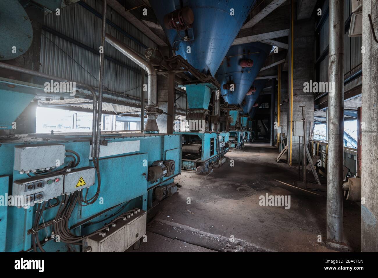 Interior of an old abandoned industrial steel factory Stock Photo - Alamy