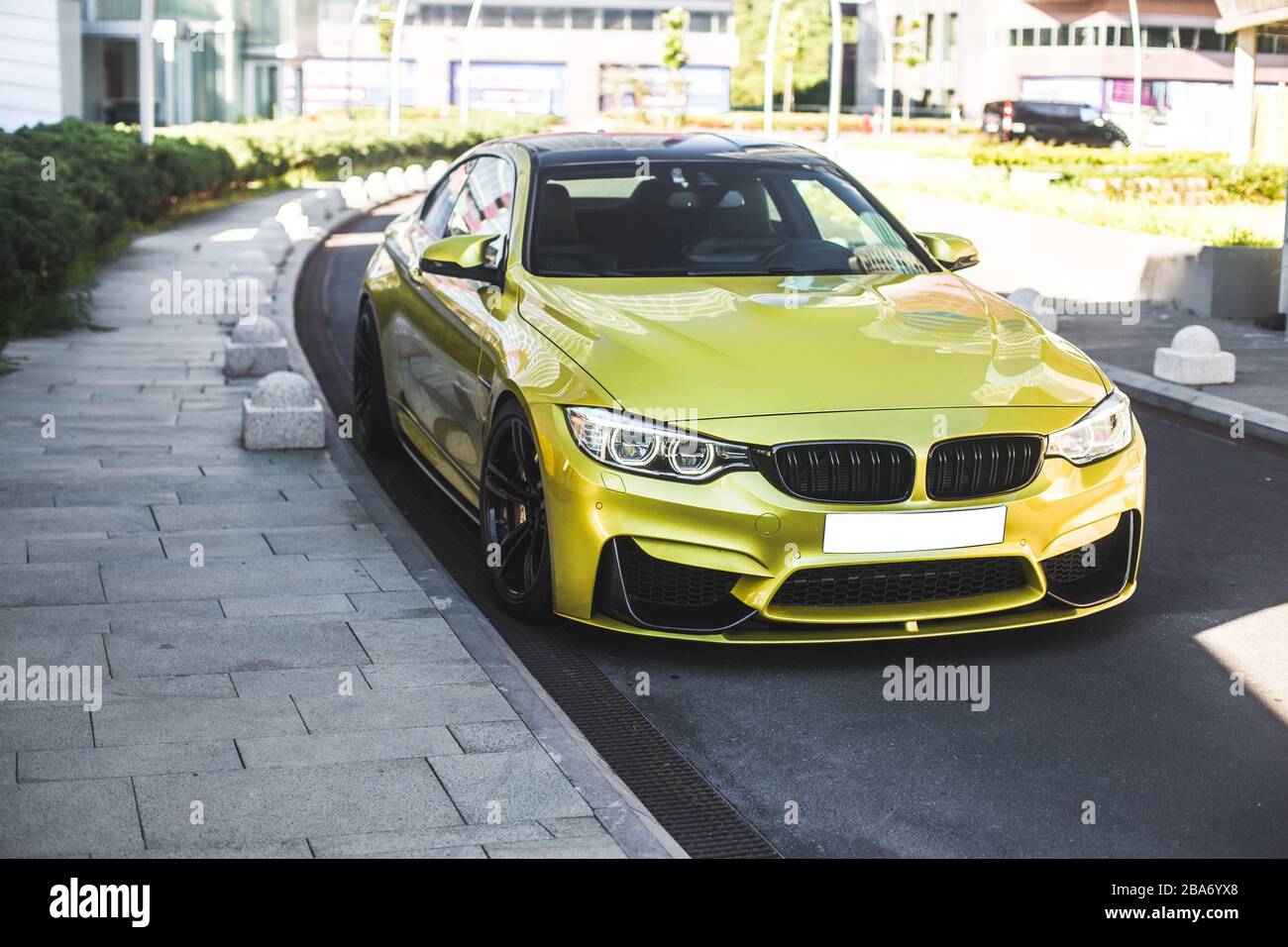 Golden color car parked on the road side Stock Photo - Alamy