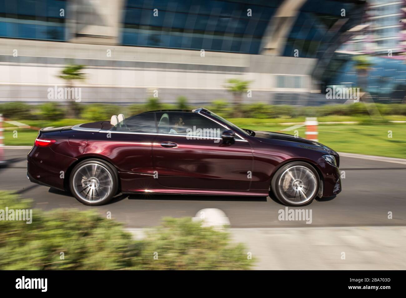 Bordeaux color luxury cabriolet in the business quarter Stock Photo - Alamy