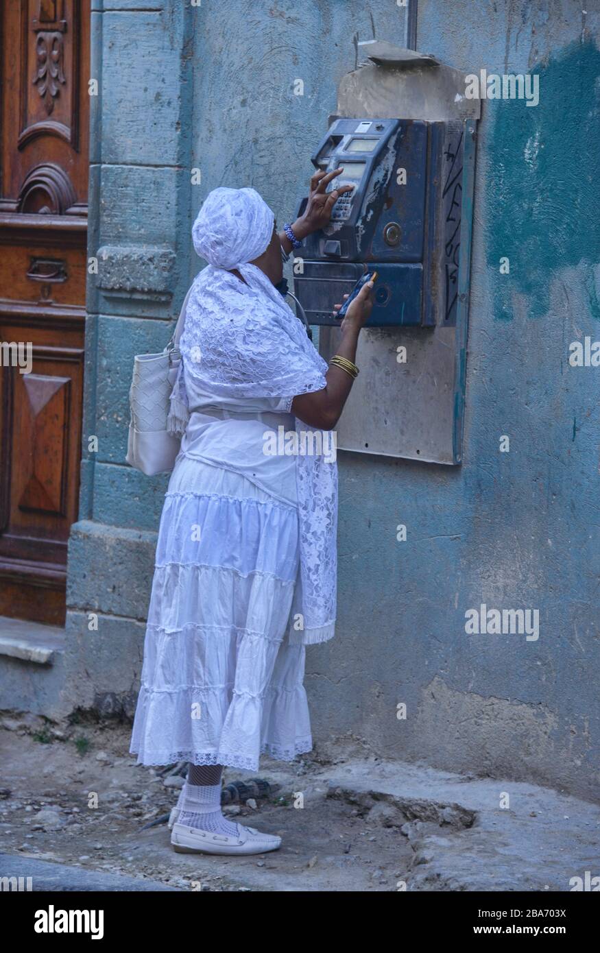 Cuban woman using the payphone, Havana, Cuba Stock Photo - Alamy