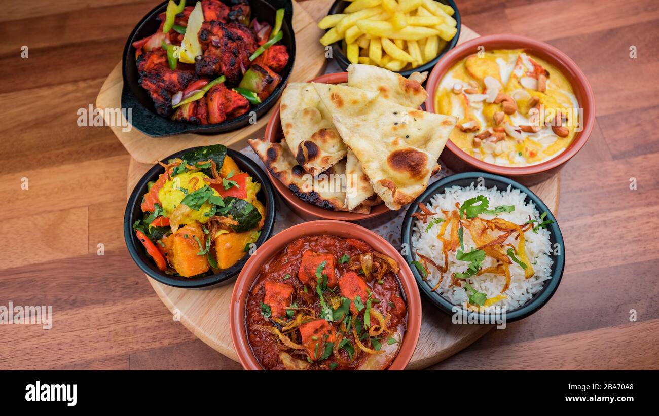 Indian style tapas curry selection which made with chicken, lamb ...