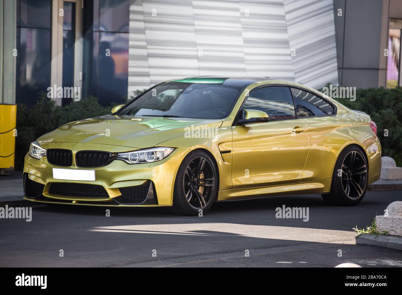Golden color business class car Stock Photo - Alamy
