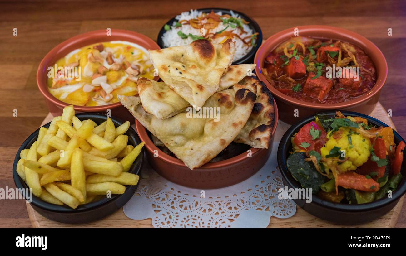 Indian style tapas curry selection which made with chicken, lamb ...