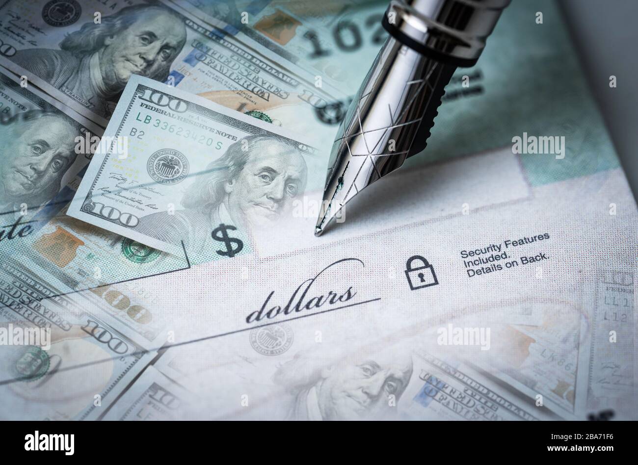 Making payments , writing the check Stock Photo - Alamy