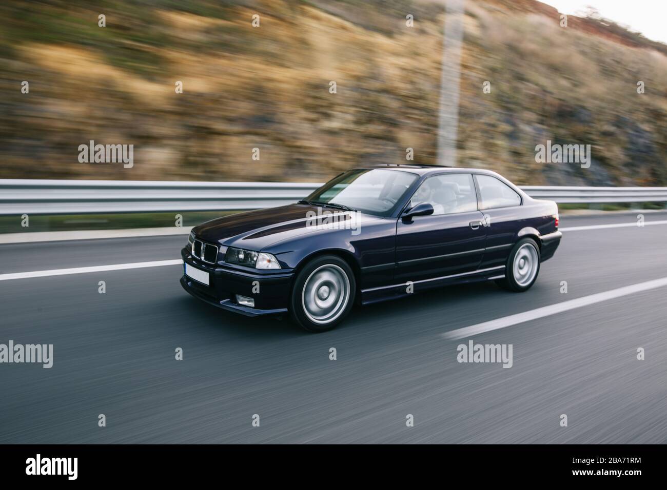 Driving an old model sedan car on the highway Stock Photo - Alamy