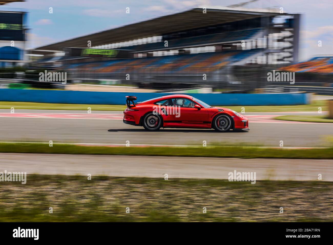Red sport car racing in the highway Stock Photo - Alamy