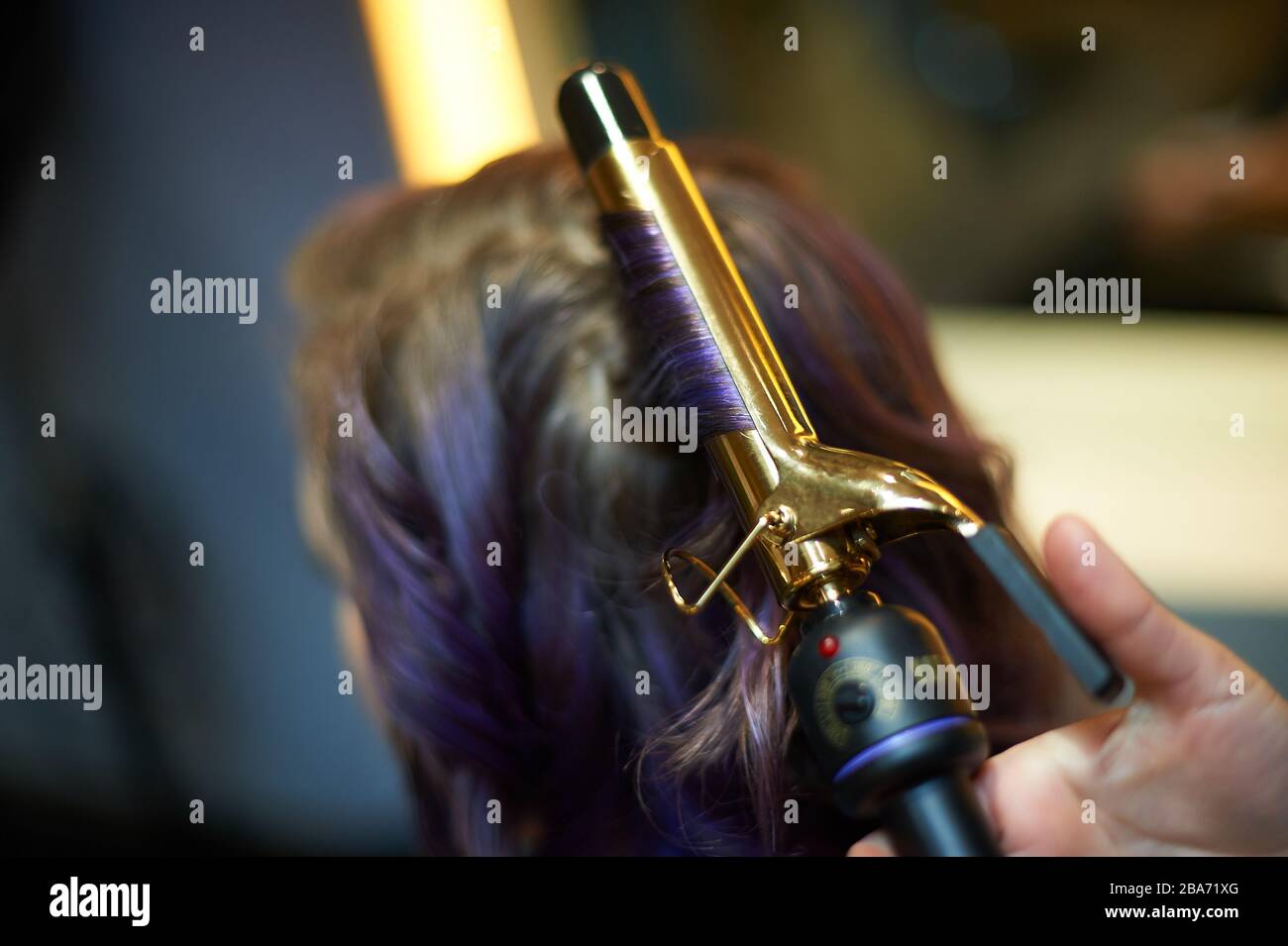 Cutting and coloring hair at a salon Stock Photo - Alamy
