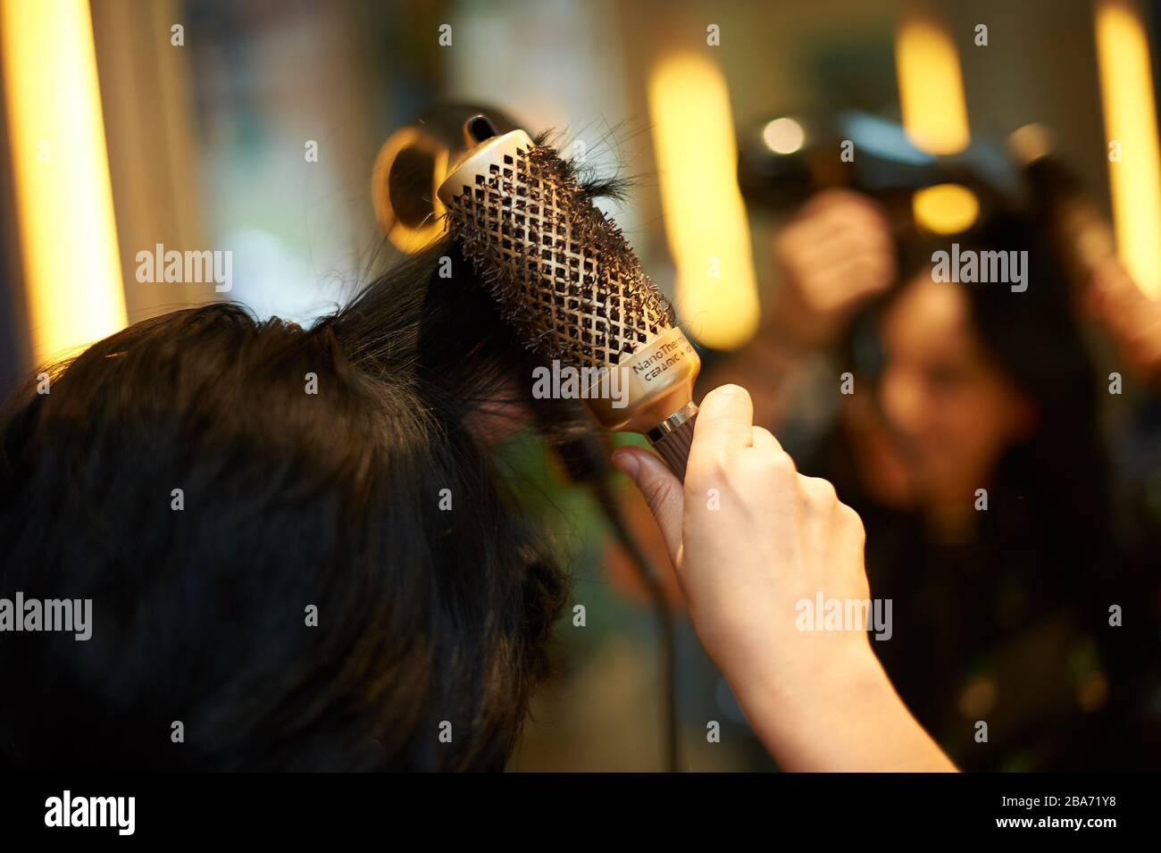 Cutting and coloring hair at a salon Stock Photo - Alamy