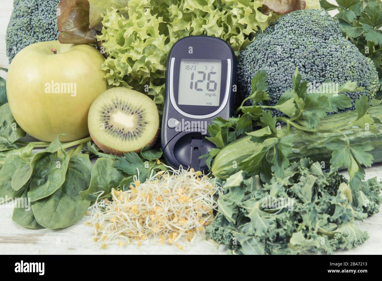 Glucometer with sugar level, fruits, vegetables and sprouts. Nutritious ...
