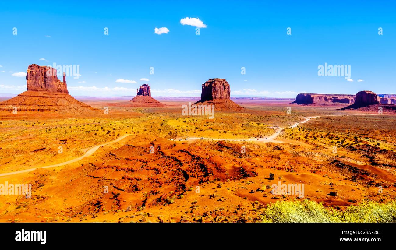 The gravel road winding around Mitten Buttes, Merrick Butte and other ...
