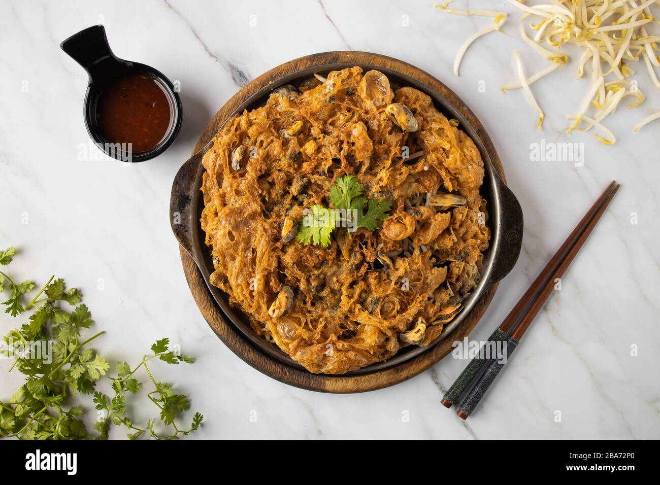 This is the picture of Crispy Fried Mussel Pancake with hot sauce in ...