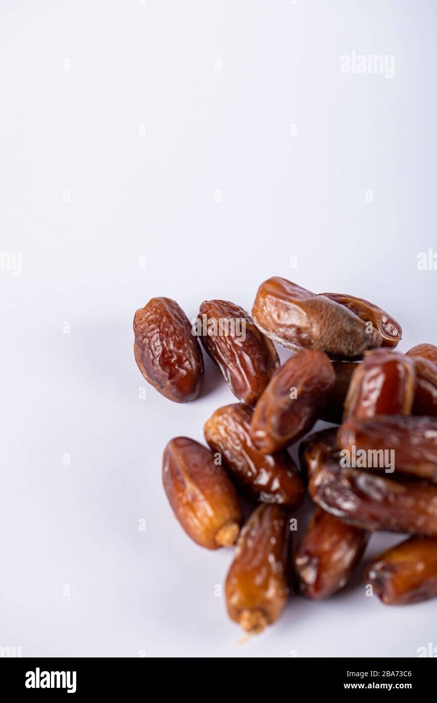 Dates on the bottom side of white. top view Stock Photo - Alamy