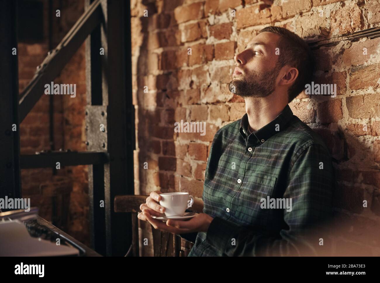 fine writer drinking morning coffee and working Stock Photo - Alamy