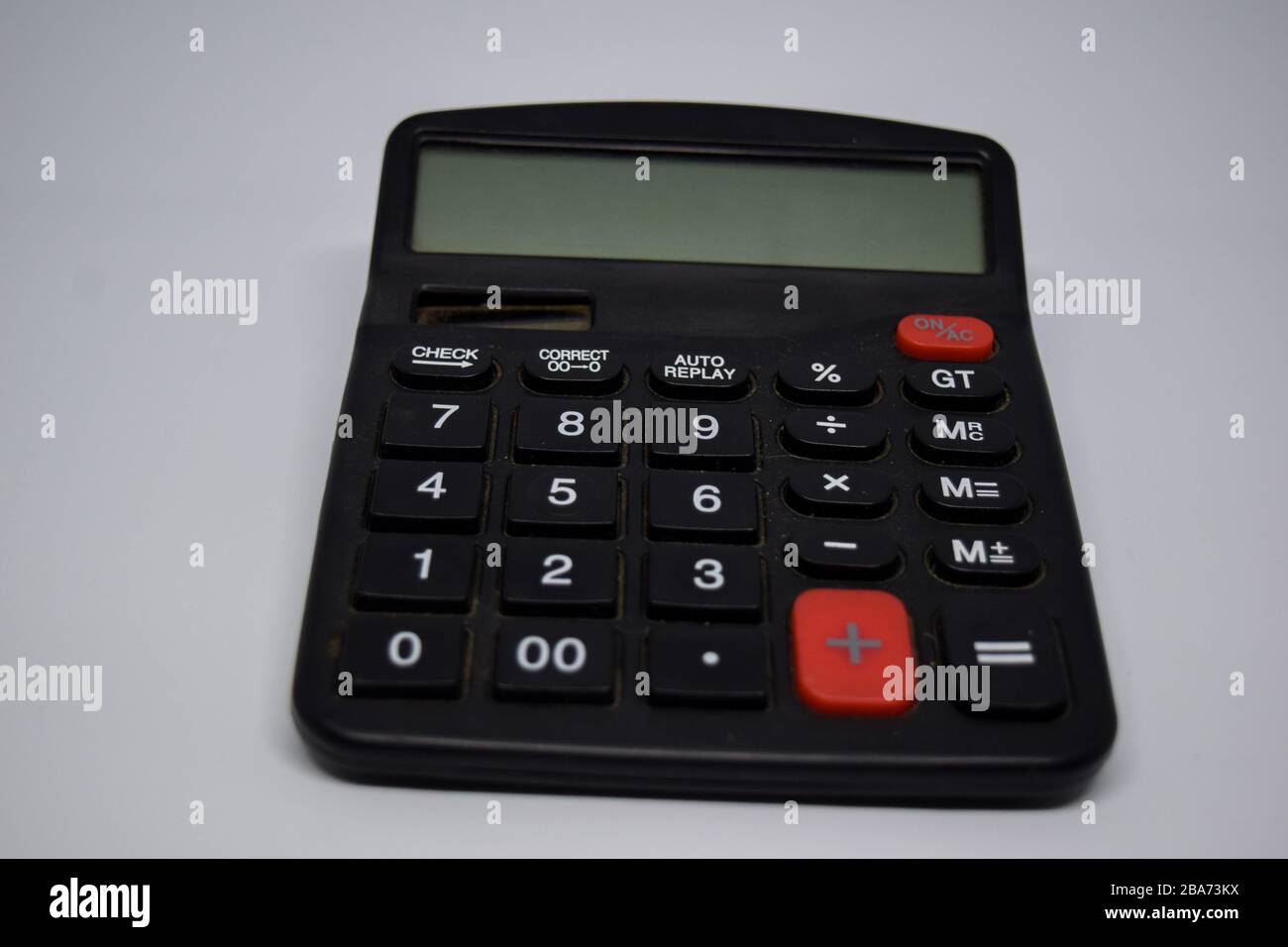 Close up black calculator isolated on white background Stock Photo - Alamy