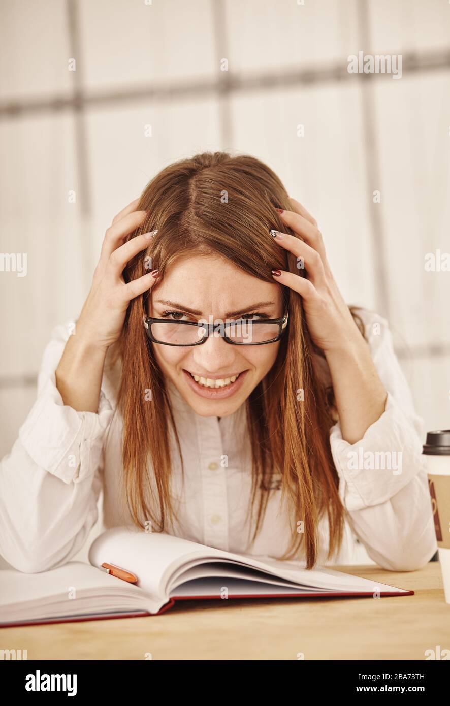 young business woman tired of working in the office Stock Photo - Alamy