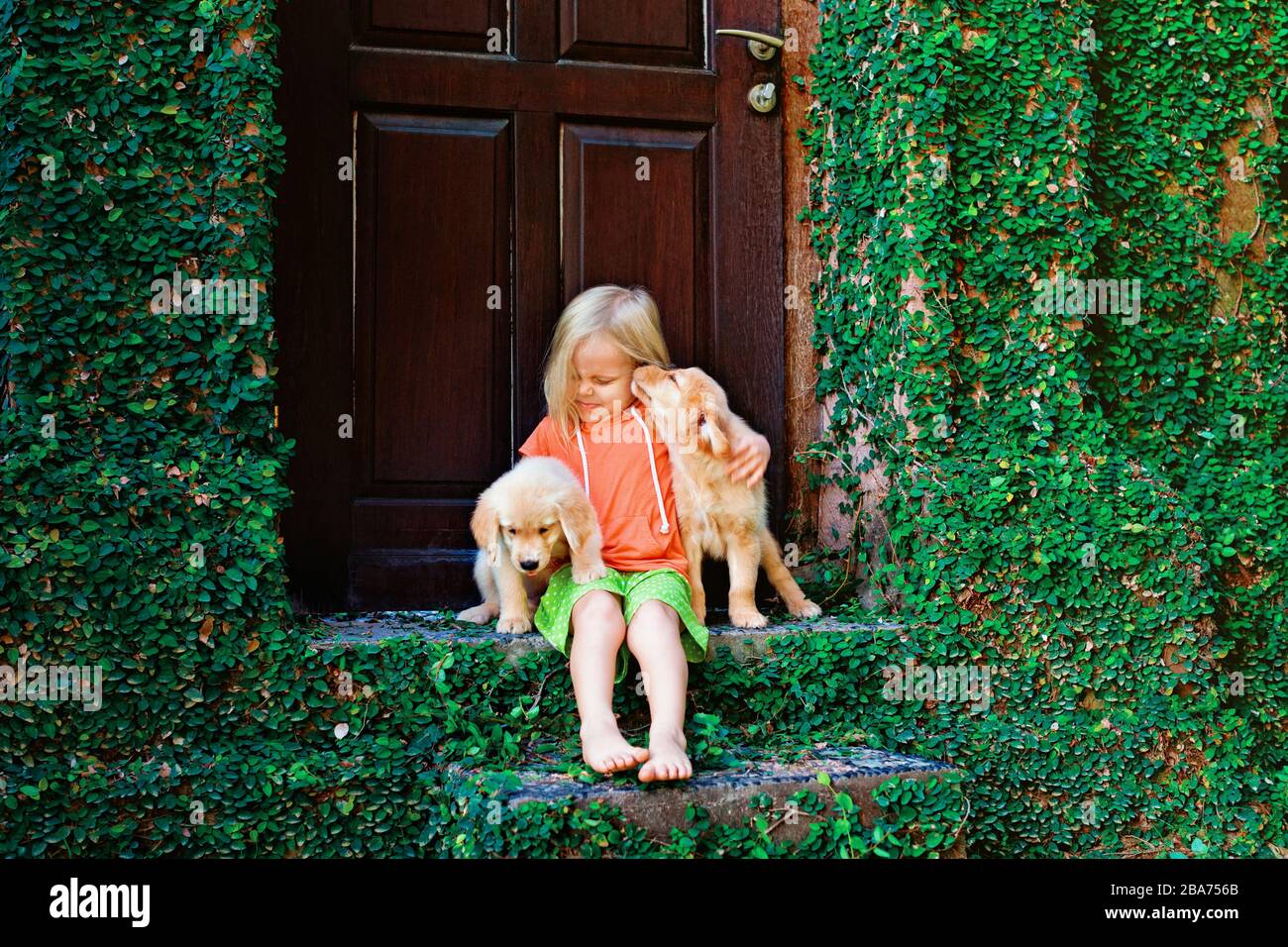 Baby Hug Dog High Resolution Stock Photography and Images - Alamy