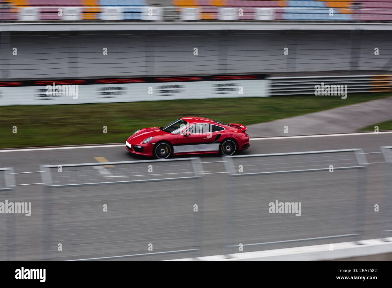 Red sport car racing on the trace Stock Photo - Alamy